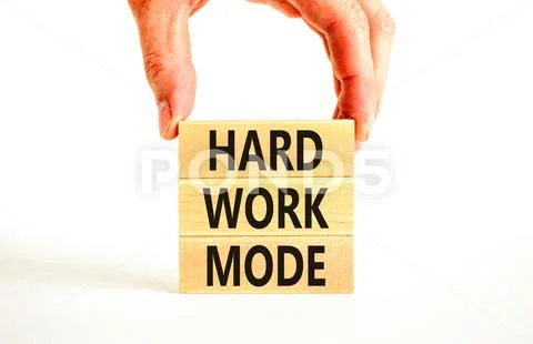 Hard work mode symbol. Concept words Hard work mode on wooden block on ...