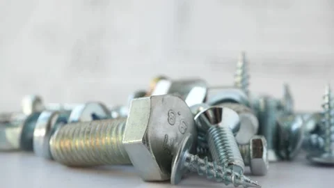 Hardware bolt, nut and screw rotation on... | Stock Video | Pond5