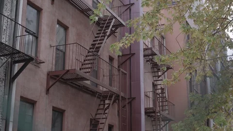 Harlem Facade with fire escapes ladders,... | Stock Video | Pond5