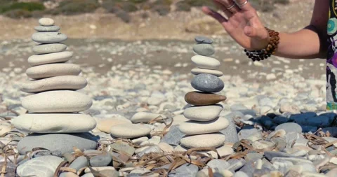 HD of female hands builds a stone stacks... | Stock Video | Pond5