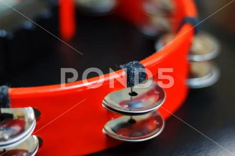 Headless tambourine red. Musical instrument on black background. Soft ...
