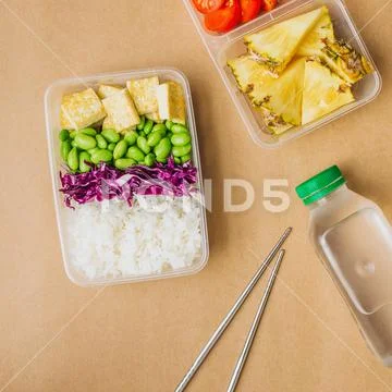 Photograph: Healthy asian-style vegan bento box with rice, fried tofu ...