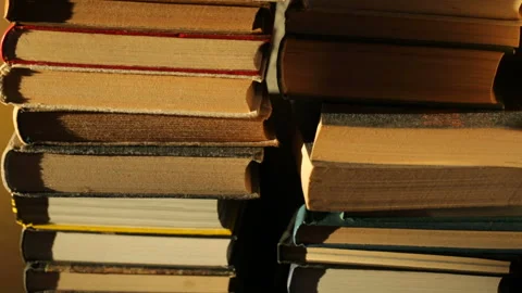 Heap of old books in sunlight | Stock Video | Pond5