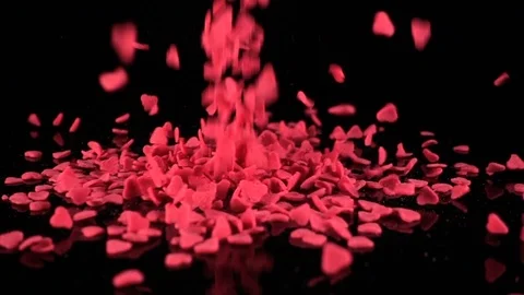 Heart Shape Red Sprinkles falling in slo... | Stock Video | Pond5