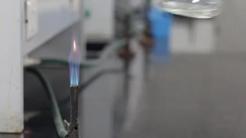 heating a colorless liquid in a conical ... | Stock Video | Pond5