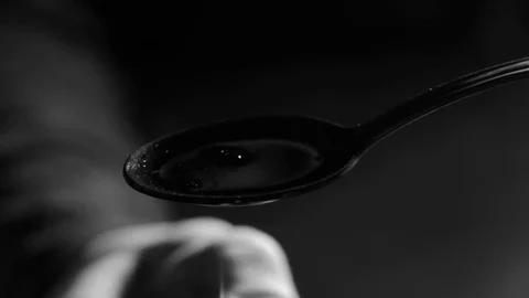 Heating Drugs Black Heroin on Spoon | Stock Video | Pond5