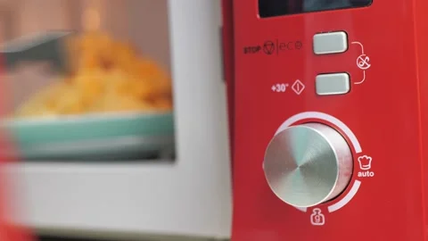 Heating food in the microwave. hand puts... | Stock Video | Pond5