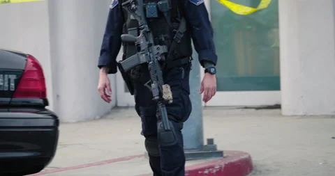 A Heavily Armed Police Officer with an A... | Stock Video | Pond5