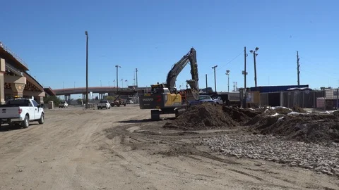 Heavy equipment working in border area | Stock Video | Pond5