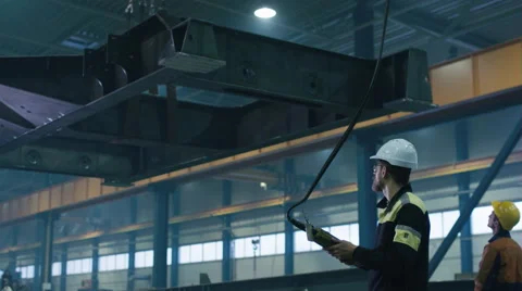 Heavy industry workers are moving a mass... | Stock Video | Pond5