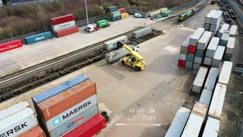 A heavy lifter unloading a shipping cont... | Stock Video | Pond5