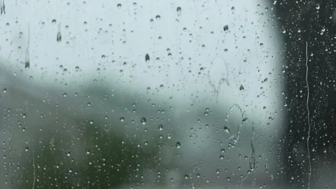 Heavy pouring rain outside the window. A... | Stock Video | Pond5