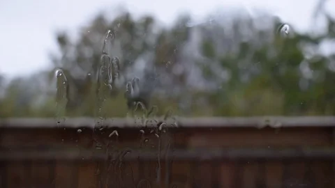 Rain Through Window Stock Footage ~ Royalty Free Stock Videos | Pond5
