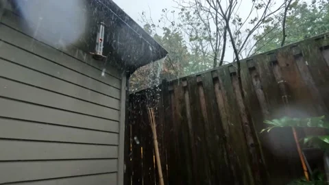 heavy rain backyard garage downspout ove... | Stock Video | Pond5