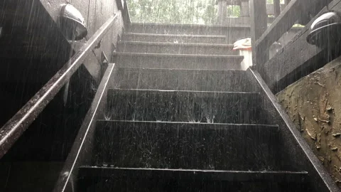 Heavy Rain Falling on to basement steps. | Stock Video | Pond5