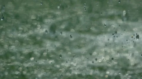 Heavy rain falling on water surface, wat... | Stock Video | Pond5