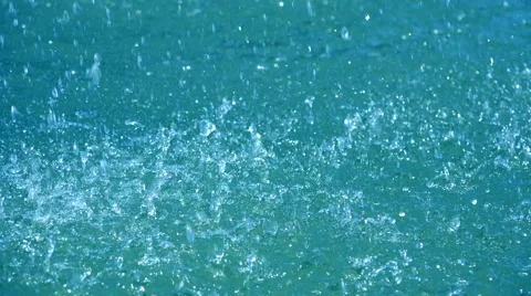 Heavy rain falling on water surface, wat... | Stock Video | Pond5