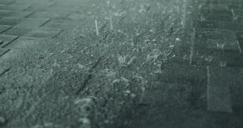 Heavy rain falls on the roof of a house ... | Stock Video | Pond5