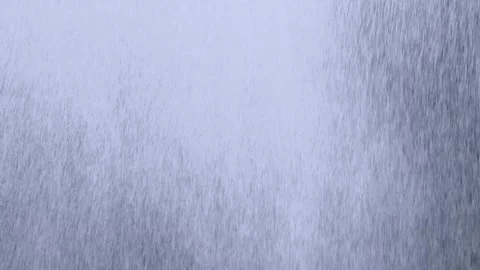 Heavy rain under full screen white light | Stock Video | Pond5