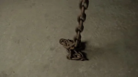 A heavy rusty chain falling on a concret... | Stock Video | Pond5