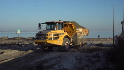 Heavy Vehicles Transporting Sand to Rest... | Stock Video | Pond5