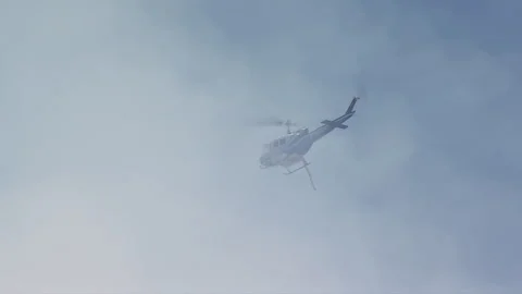 Helicopter Disappears Flying Into Clouds Stock Video Pond5