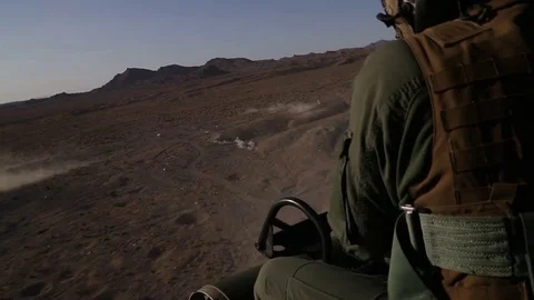 Helicopter door gunner firing machine gu... | Stock Video | Pond5