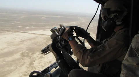 helicopter door gunner readies machine g... | Stock Video | Pond5