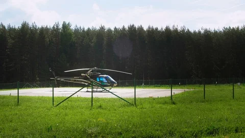 Helicopter on helipad against the backgr... | Stock Video | Pond5