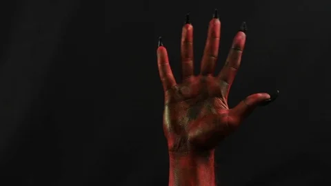 Hello gesture by devil hand. | Stock Video | Pond5