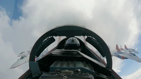 Helmeted pilot fly stunt fighter jet. Gr... | Stock Video | Pond5