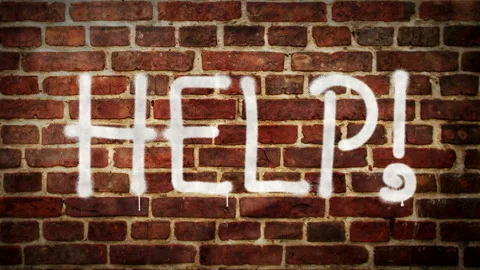 Help sign spray painted on the brick wal... | Stock Video | Pond5