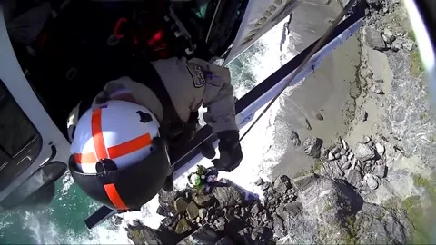 Heroic Helicopter Rescue of Woman and Do... | Stock Video | Pond5