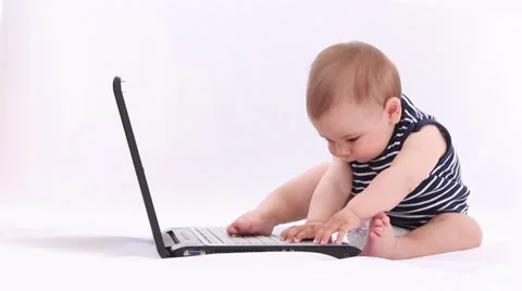 Hi Tech Baby. Boy playing with a laptop ... | Stock Video | Pond5