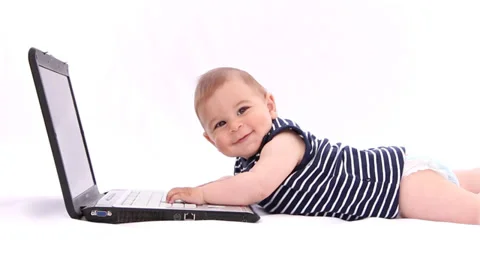 Hi Tech Baby. Boy playing with a laptop ... | Stock Video | Pond5