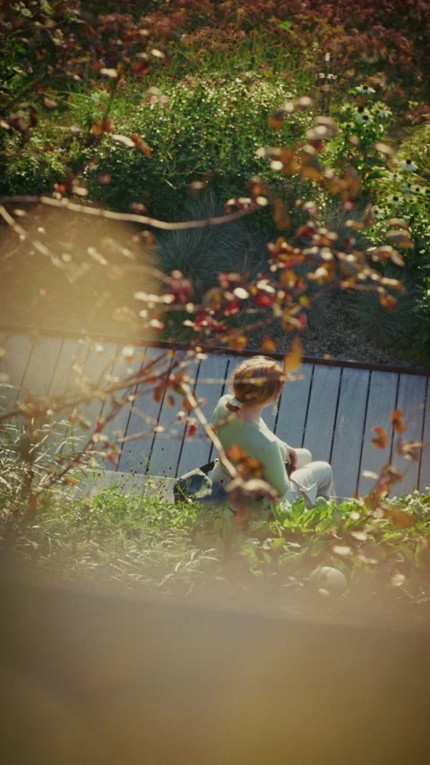High-Angle Shot Of Girl Sitting On Rooft... | Stock Video | Pond5