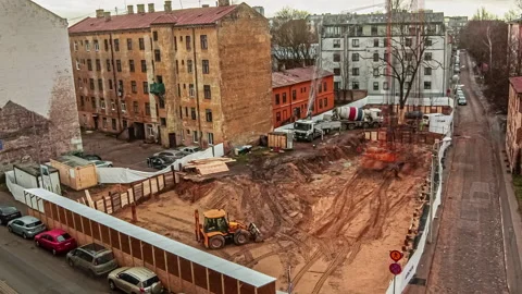 High angle shot oer cranes and trucks bu... | Stock Video | Pond5