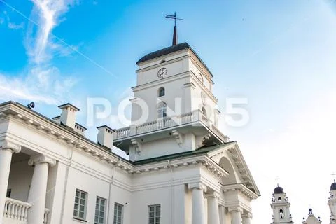 High building with stucco, spire and clock ~ Hi Res #159548483