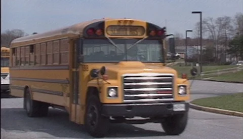 High School Buses pulling out after scho... | Stock Video | Pond5