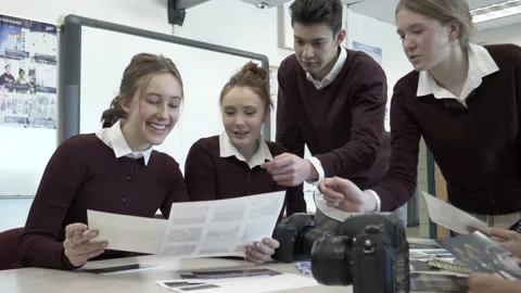 High school students reviewing photograp... | Stock Video | Pond5