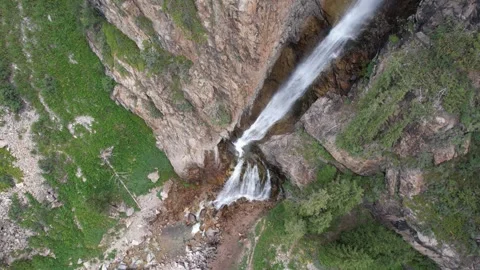 A high waterfall cascades in a mountain ... | Stock Video | Pond5
