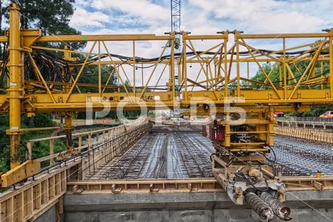 Photograph: Highway bridge construction Terex concrete paver front view ...
