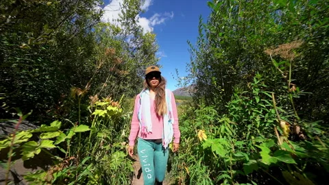 Hiking trail following women female mode... | Stock Video | Pond5