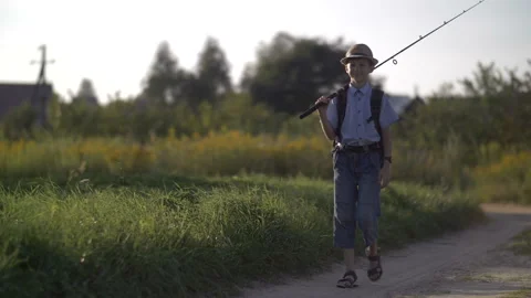 Hillbilly boy goes fishing with a fishin... | Stock Video | Pond5