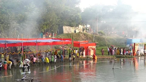 Hindu devotees busy in worship of Chath ... | Stock Video | Pond5
