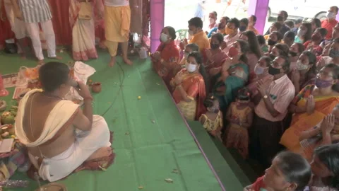 Hindu devotees offering pushpanjali to G... | Stock Video | Pond5