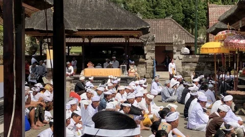 Hindus men pray inside Ulun Dane Beratan... | Stock Video | Pond5