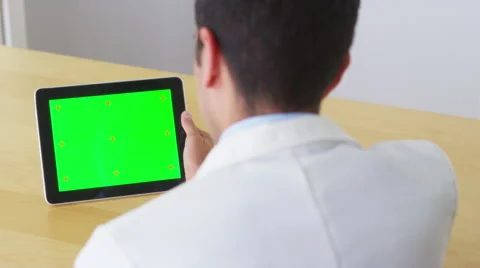 Hispanic doctor talking to tablet with g... | Stock Video | Pond5