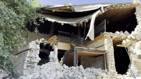 A historic stone-walled building was dam... | Stock Video | Pond5