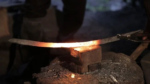 Hit a steel sword by antique process in ... | Stock Video | Pond5